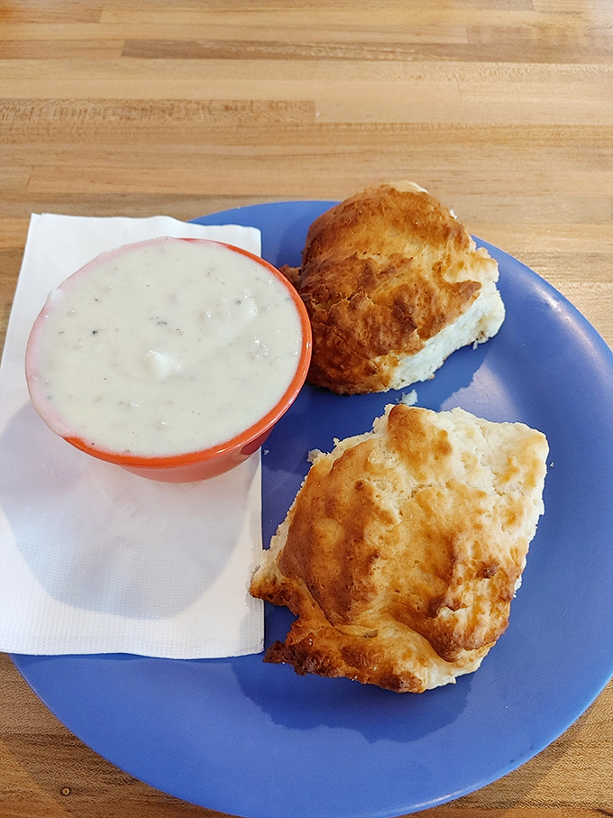 Biscuits so fluffy they could float away if not anchored by that perfect pool of peppery country gravy.