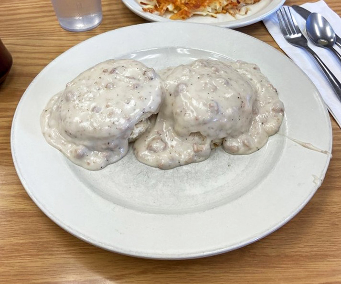 Biscuits and gravy so authentic they should come with their own Southern accent. Cloud-like biscuits swimming in peppery comfort.