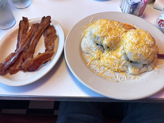 Biscuits blanketed in creamy gravy alongside bacon strips that achieved the perfect balance between crisp and chewy&mdash;breakfast nirvana achieved.