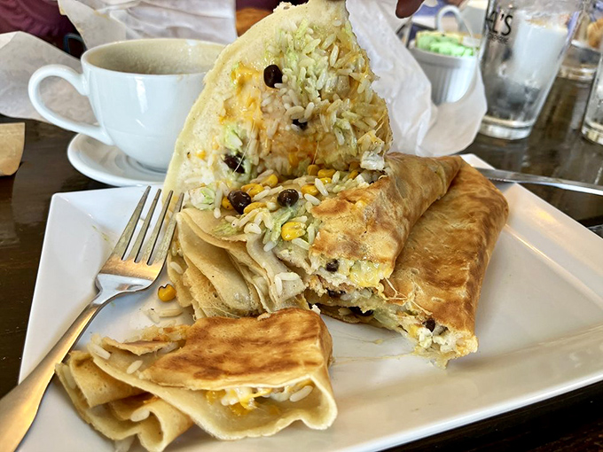 This savory creation proves that burritos and crepes were destined to meet, creating a cross-cultural breakfast alliance that works surprisingly well.