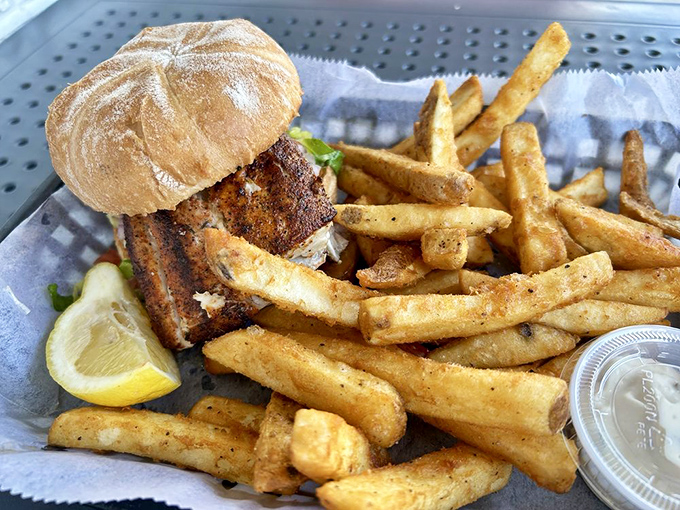A blackened mahi sandwich that makes other sandwiches jealous. The perfect ratio of fish to bun, with fries that refuse to be ignored.