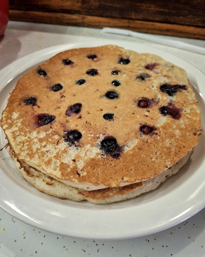 Blueberry pancakes that should be in a museum. Each berry creates pockets of warm, jammy treasure.