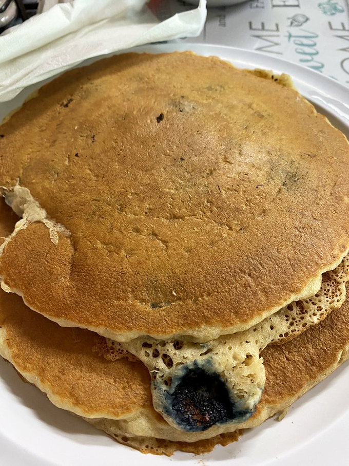 Blueberry pancakes with perfect golden edges &ndash; the breakfast equivalent of finding an extra twenty in your winter coat pocket.
