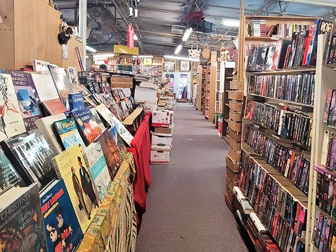 Literary adventures await in towering shelves where first editions mingle with beloved paperbacks from every era imaginable.