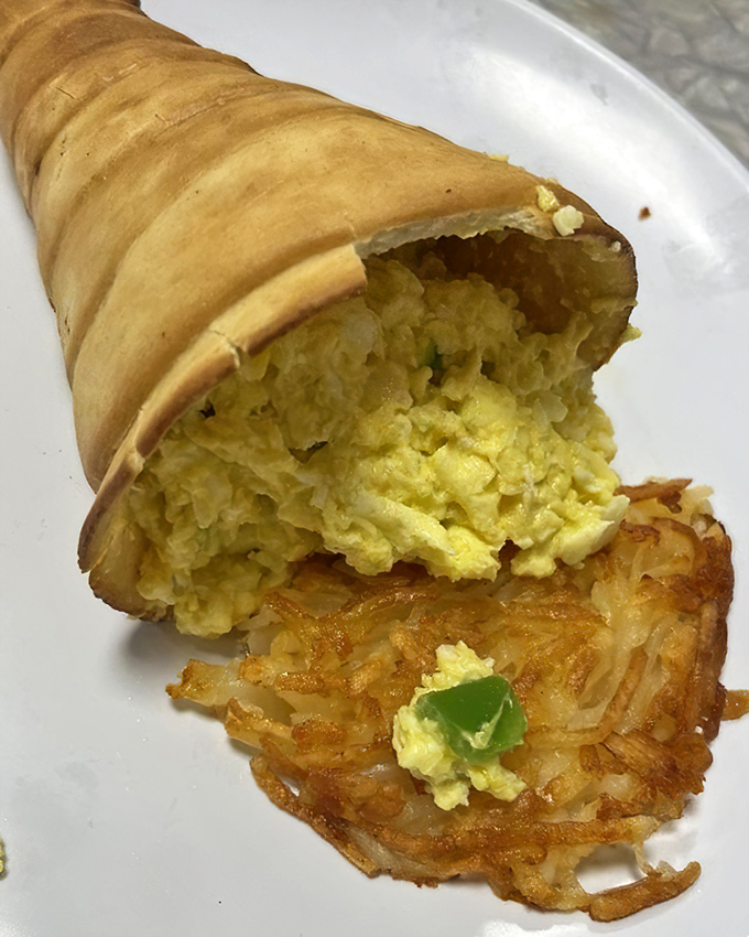Breakfast innovation that deserves applause! This cone-shaped delivery system for eggs and hash browns is pure morning genius.