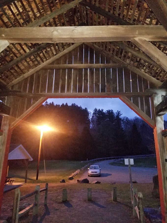 As dusk falls, the bridge takes on a magical quality, its wooden frame silhouetted against the twilight sky like a portal to the past.