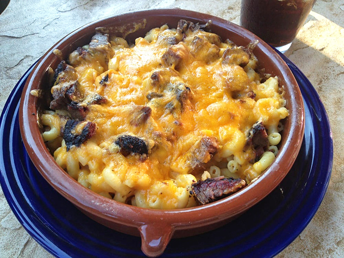 Mac and cheese gets the VIP treatment with smoky brisket joining the party, creating comfort food that's dressed for a night out.