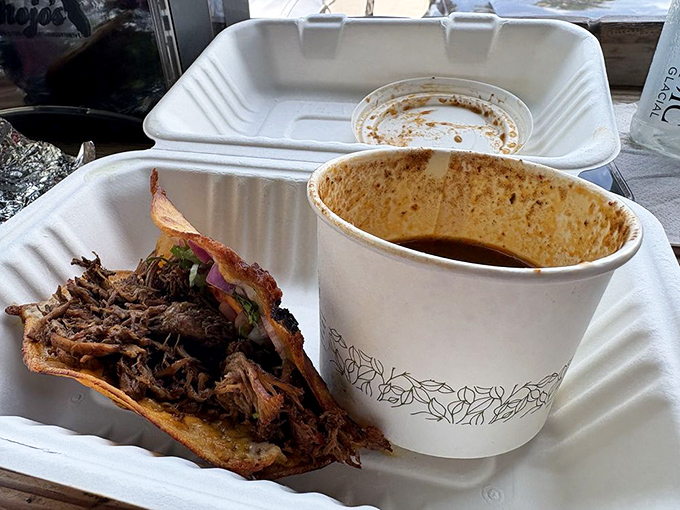 This brisket taco isn't just lunch—it's a commitment to excellence that pairs perfectly with that cup of consommé on the side.