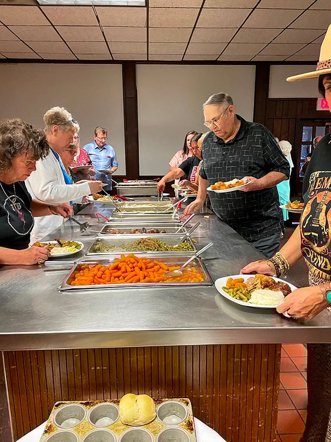 The buffet line—where Midwestern restraint meets its match. Those rolls at the bottom aren't just bread, they're edible Indiana currency.