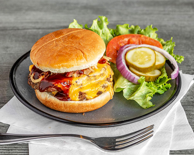 A barbecue burger that makes other burgers question their life choices. That melted cheese cascading over smoky meat is what sandwich dreams are made of.