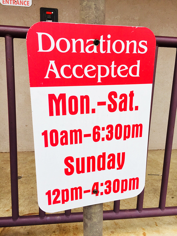 The donation hours sign&mdash;the gateway instructions for how your castoffs become someone else's treasures. The circle of thrift life continues.