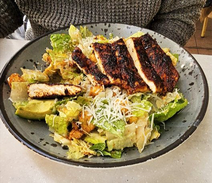 This Caesar salad with blackened chicken proves that healthy-ish choices can still be flavor bombs that make your taste buds high-five each other.