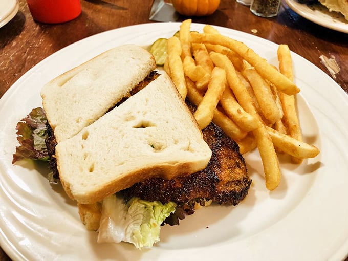 This sandwich doesn't just sit on the plate&mdash;it commands attention with its substantial presence and golden-crusted bread flanked by perfectly crisp fries.