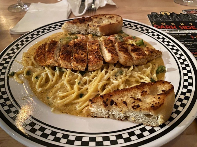 This Cajun chicken pasta proves The Lucky Dill isn't just about sandwiches. That garlic bread looks like it could start arguments over who gets the last piece.