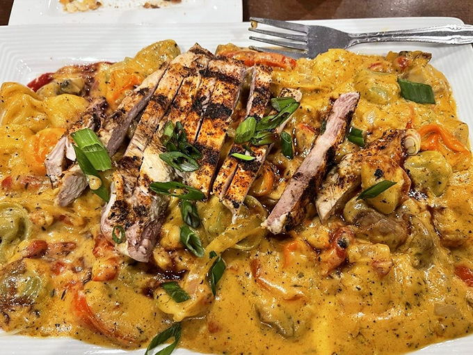 Tortellini swimming in a creamy Cajun sauce with perfectly grilled chicken&mdash;proof that Italian cuisine plays well with other flavor profiles.