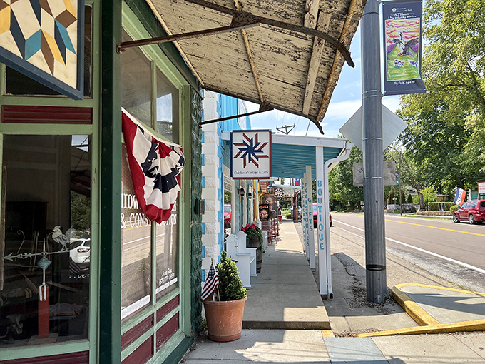The patriotic bunting and quilt square sign create an Americana vignette straight from a Norman Rockwell painting.