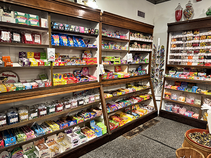 A candy wonderland that would make Willy Wonka jealous – shelves stocked with nostalgic treats that transport you straight back to childhood.