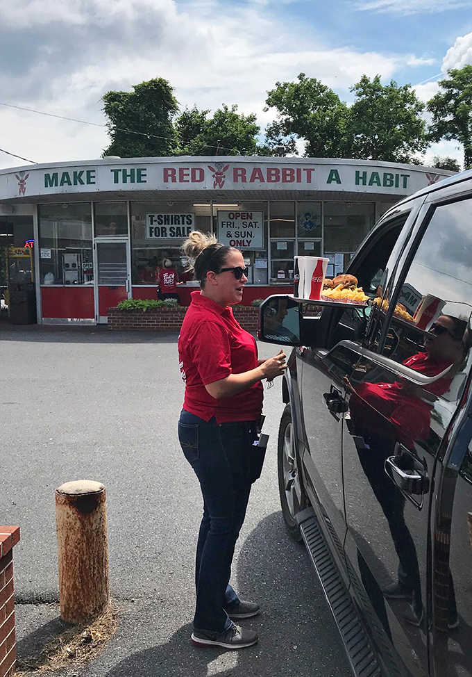 The sacred ritual of carhop service: food delivered right to your window, transforming your Subaru into the best restaurant in town. 