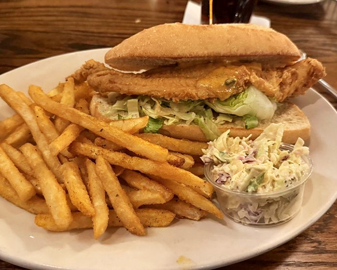 The ultimate sandwich showdown – crispy fried fish, fresh toppings, and enough fries to make sharing optional but not recommended.
