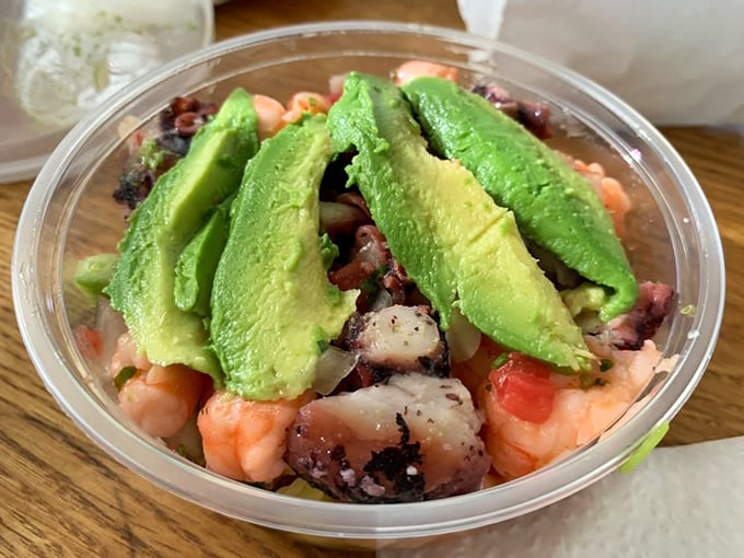 Ceviche that looks so fresh it might still have its sea legs. Those avocado slices are wearing their ripeness like a designer outfit.