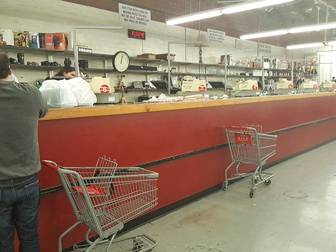The checkout counter&mdash;final gateway between thrift store treasures and their new homes. Those red counters have witnessed countless victorious finds.