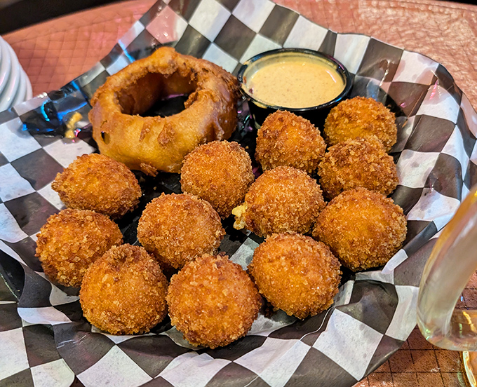 These golden-fried cheese bites with that onion ring centerpiece aren't just appetizers&mdash;they're a warm Midwestern hug on a plate.