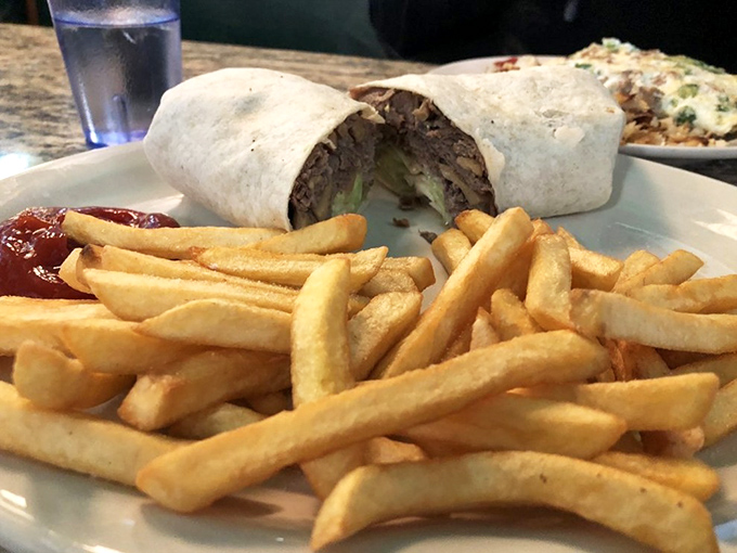 A proper wrap should require both hands and generate enough joy to last until dinner. This cheese steak version checks both boxes.
