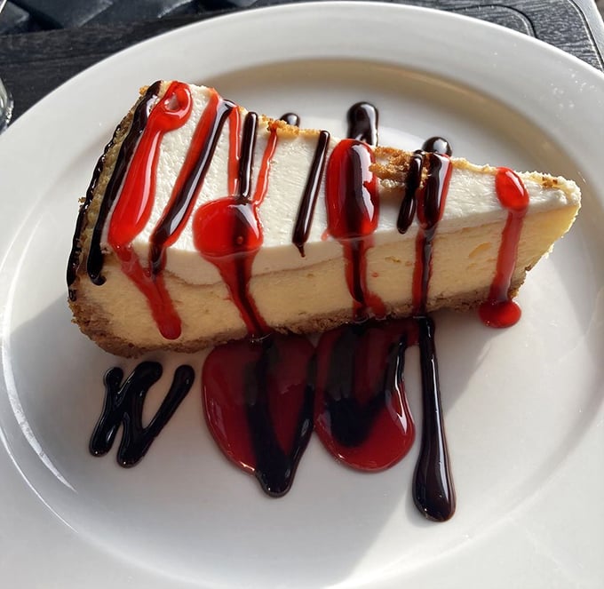 Cheesecake drizzled with raspberry and chocolate sauces that makes you want to skip dinner entirely. Life's short; eat dessert first.