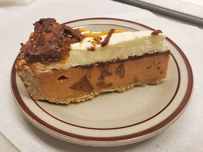 This isn't just cheesecake&mdash;it's architecture. The layers tell a story of indulgence that makes you forget words like "moderation" and "portion control." 