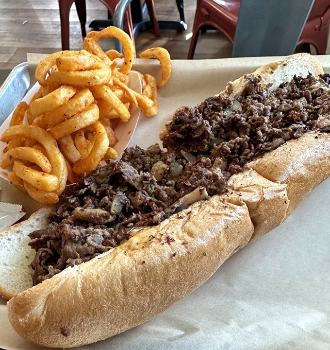 A proper cheesesteak paired with golden curly fries. The kind of meal that makes you consider moving to Lancaster permanently.