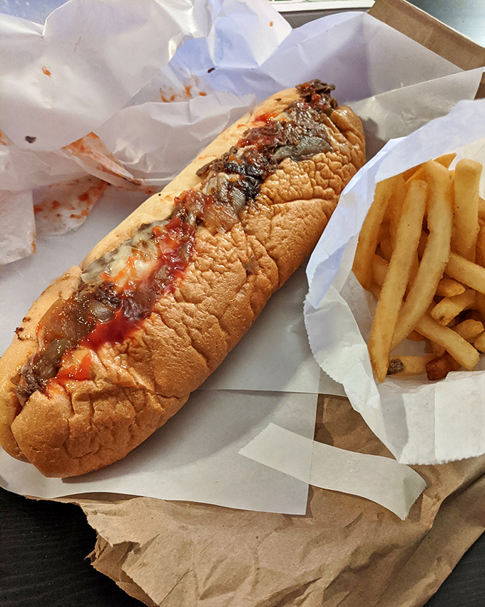 Behold the finished masterpiece &ndash; a proper cheesesteak with golden fries. A Pennsylvania tradition that needs no passport to appreciate.