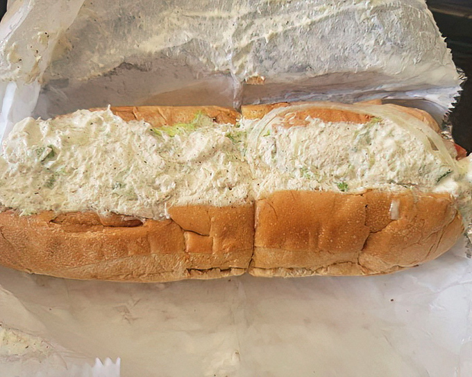 The chicken salad sub arrives like a creamy cloud on a fresh roll. Generous portions make this humble sandwich a meal that satisfies both body and soul.