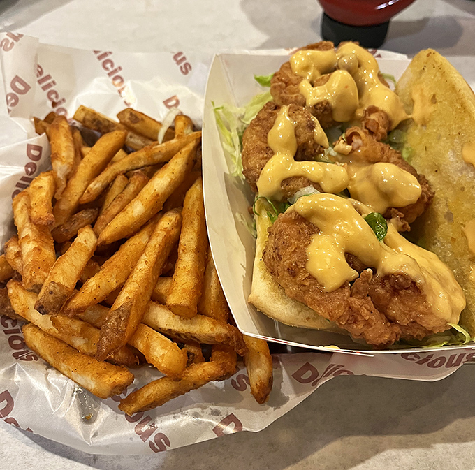 This po' boy isn't just a sandwich&mdash;it's architectural genius. The golden-fried protein nestled in that soft bread with remoulade sauce cascading down is poetry in carb form. 