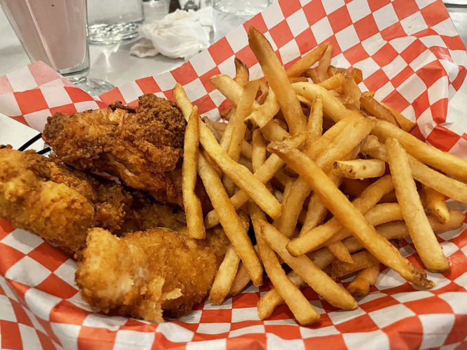 Chicken tenders and fries served in that classic red-checkered paper&mdash;because some diner traditions are too perfect to mess with.