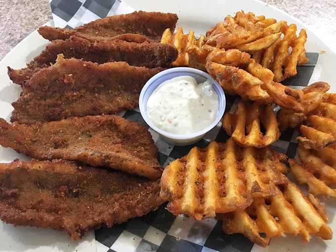 Chicken tenders with the golden ratio of crunch-to-tenderness. Those waffle fries aren't just sides&mdash;they're wingmen of the highest caliber.