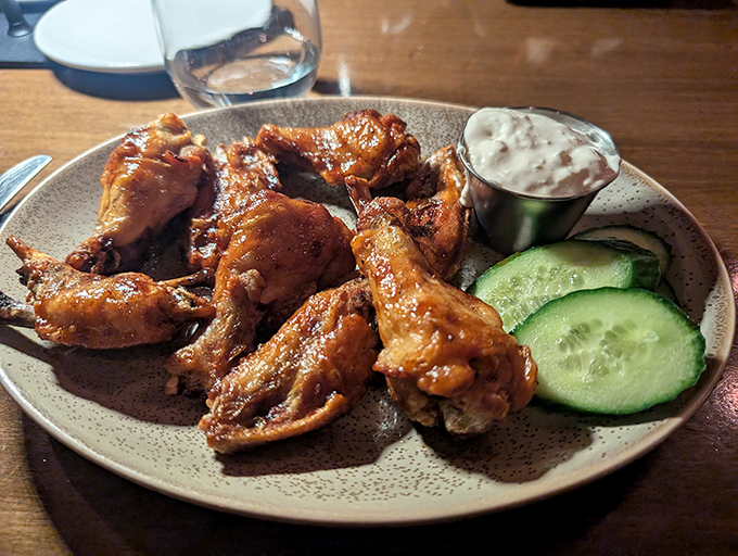 Wings that make you question why we ever invented forks. The blue cheese dip isn't an afterthought&mdash;it's an essential supporting character.