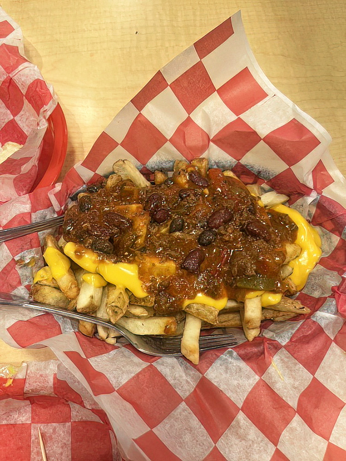 Chili cheese fries: where excess meets excellence. This glorious mess of golden fries, molten cheese and hearty chili requires a fork, napkins, and absolutely zero regrets.