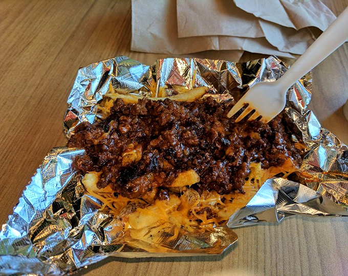 Chili cheese fries that laugh in the face of diet plans. A glorious mess of beef, cheese, and potatoes that's worth every napkin.