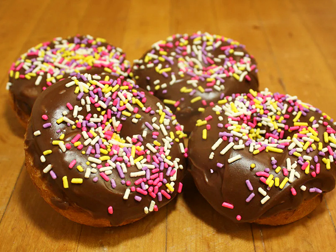 Chocolate iced with rainbow sprinkles: proof that sometimes the classics endure because they're simply perfect. Joy in circular form.