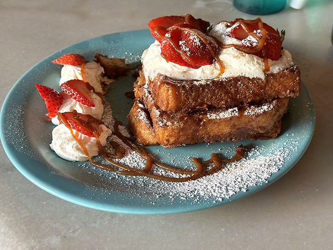 This isn't just French toast&mdash;it's an architectural achievement with whipped cream mortar and strawberry shingles.