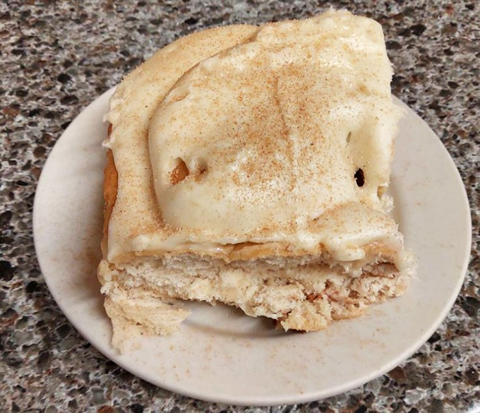 Cinnamon rolls frosted so generously they could double as a winter weather advisory. Worth every sticky finger and guilty smile.