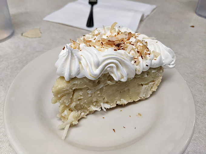 Coconut cream pie with a cloud of whipped cream and toasted coconut flakes&mdash;the sweet finale that justifies every mile of your journey.
