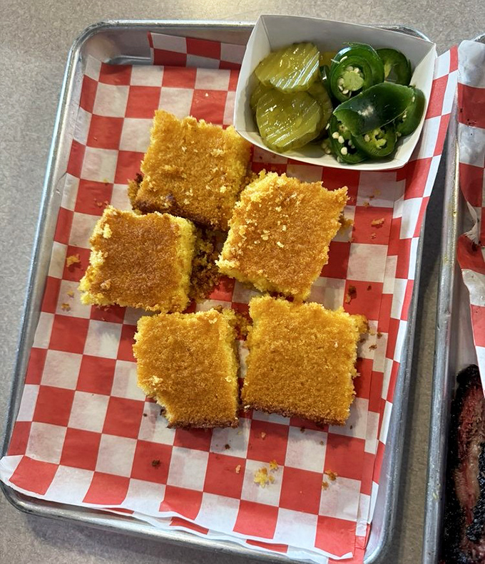 Golden cornbread squares with pickles and jalape&ntilde;os &ndash; the perfect supporting cast for any barbecue main event. 