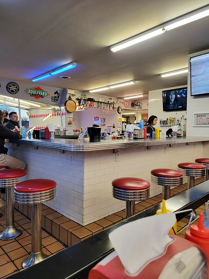 Those classic red counter stools aren't just seating—they're time machines to when sitting at the counter was the coolest spot in the joint.