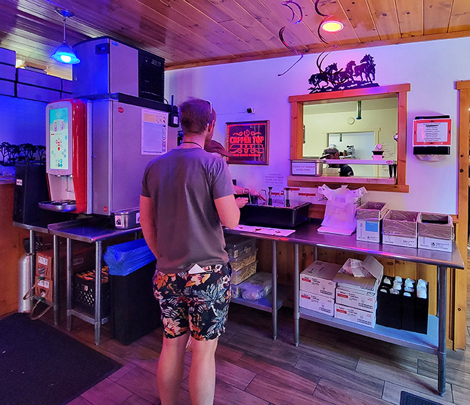 The ordering counter—where dreams come true and diet plans go to die, all with a smile and the aroma of wood smoke.