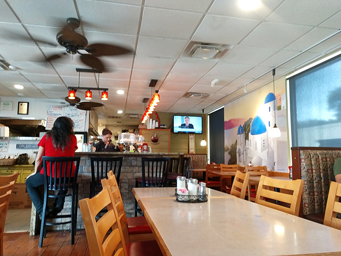 Morning light streams through windows as red pendant lights cast a warm glow. Some come for the food, but the regulars stay for this homey embrace.