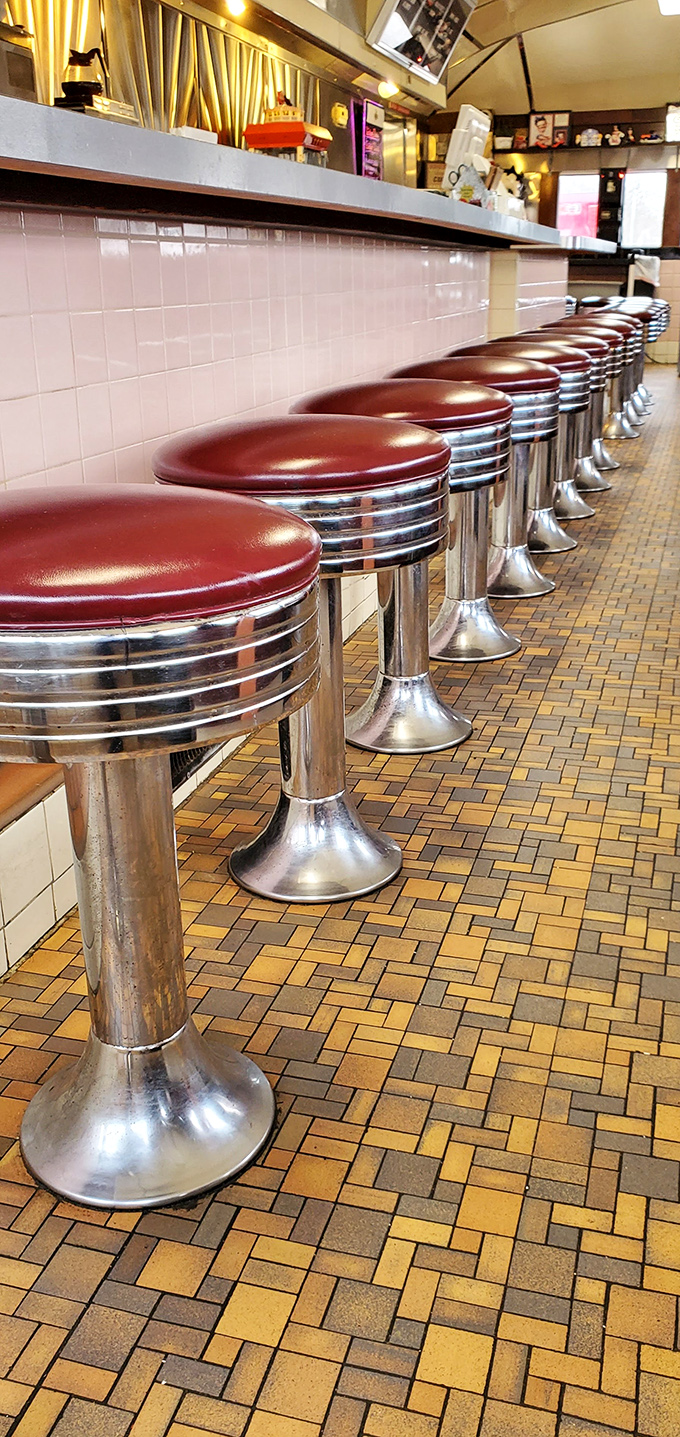 These chrome and vinyl counter seats have witnessed more heartfelt conversations and food epiphanies than most therapists' couches.