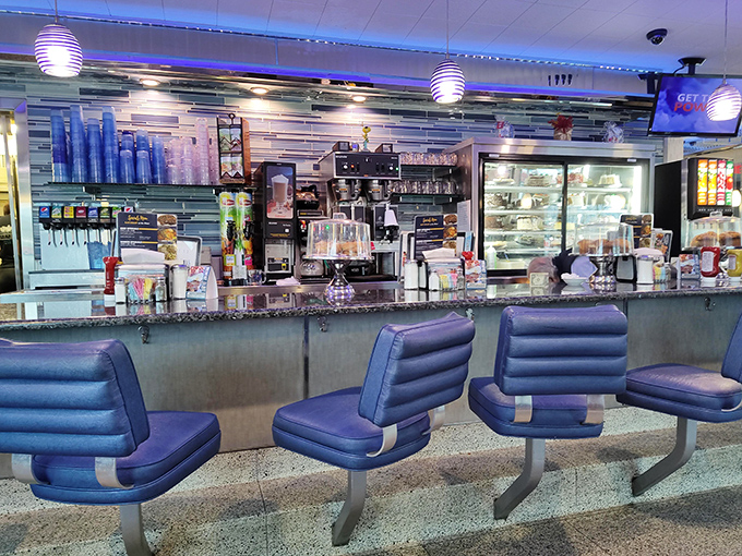 The classic diner counter where coffee flows freely and conversations happen between bites of breakfast bliss.