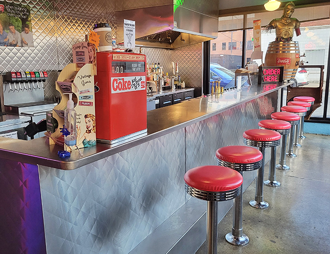 Counter seating offers front-row views of the kitchen magic happening behind the diamond-plate steel surfaces.
