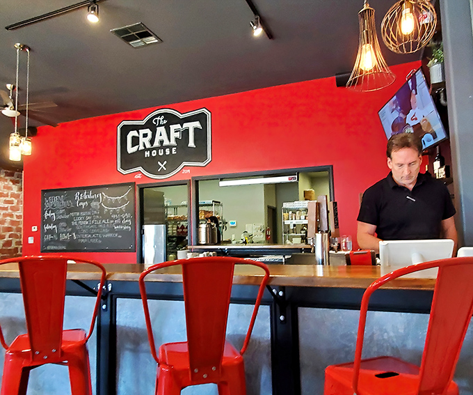 Counter seating offers front-row tickets to the culinary show, with those red chairs practically begging you to stay for "just one more bite."
